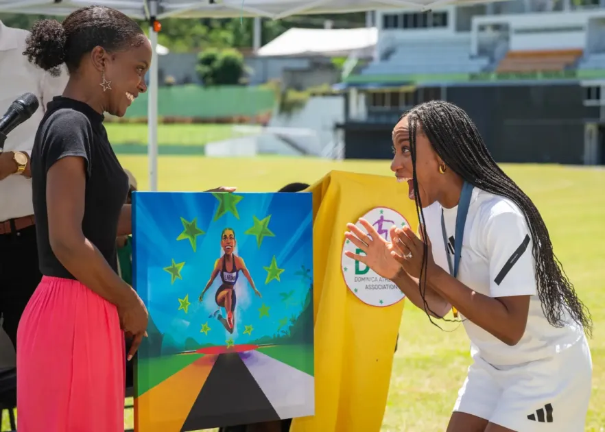 Thea Lafond gets delighted seeing her portrait made by Dominican artist ...